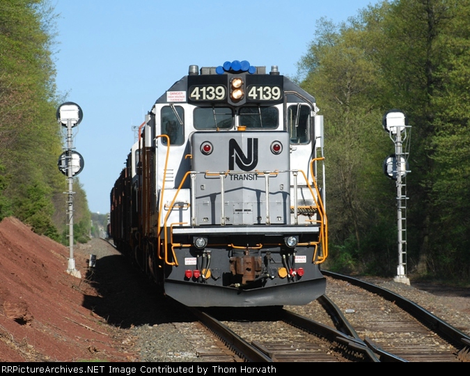 NJT 4139 pushes a string of ballast hoppers east at RVL's MP 37